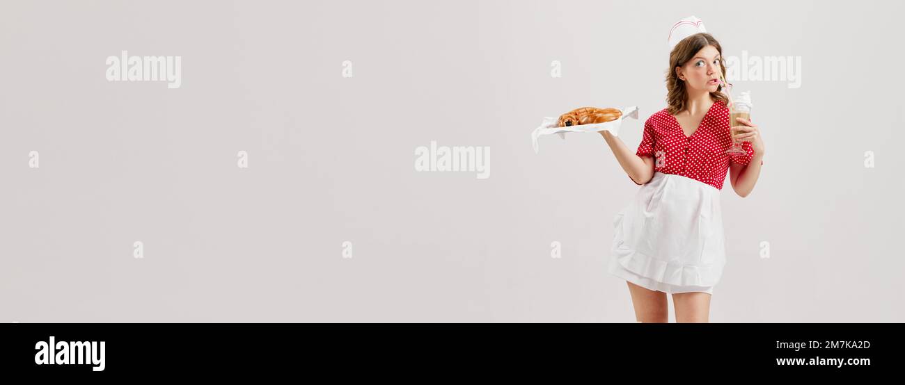 Portrait of young pretty waitress, woman in retro american fashion ...