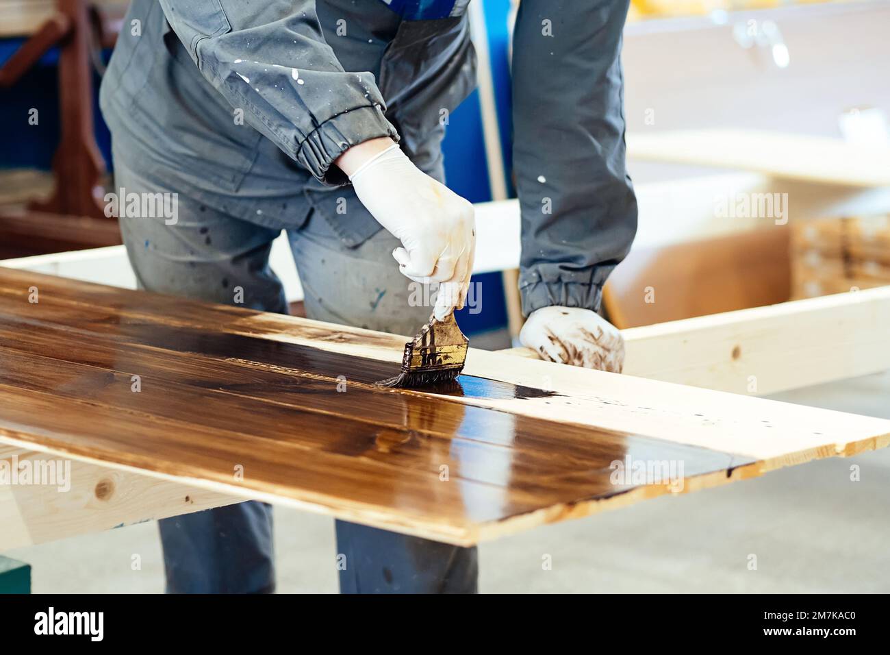 Man paints wooden boards hi-res stock photography and images - Alamy