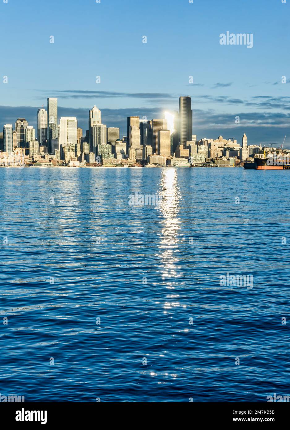 The sun reflects from buildings in the skyline of Seattle, Washington ...