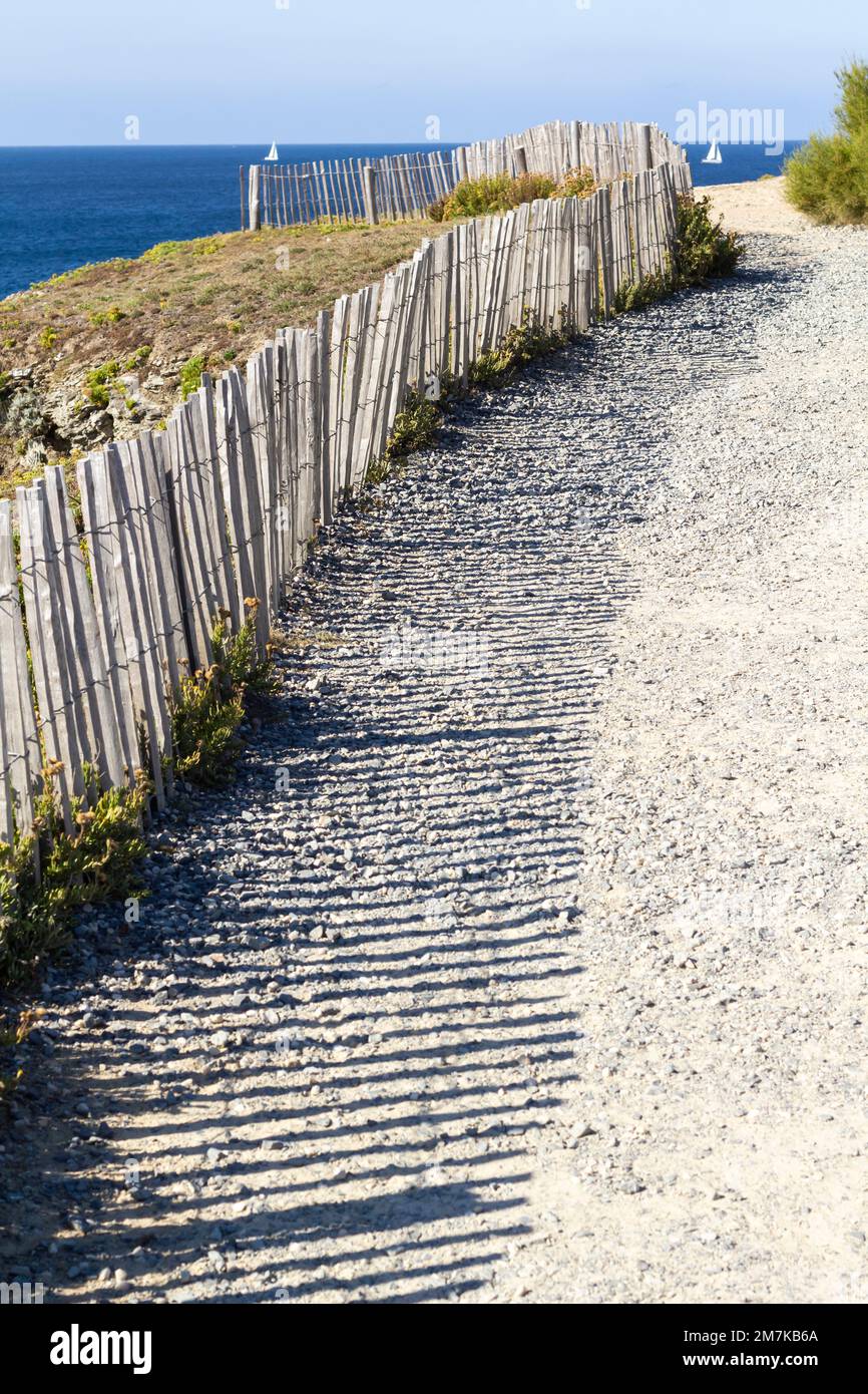 Typical french coast sea view with a pathway to the beach and wooden ...