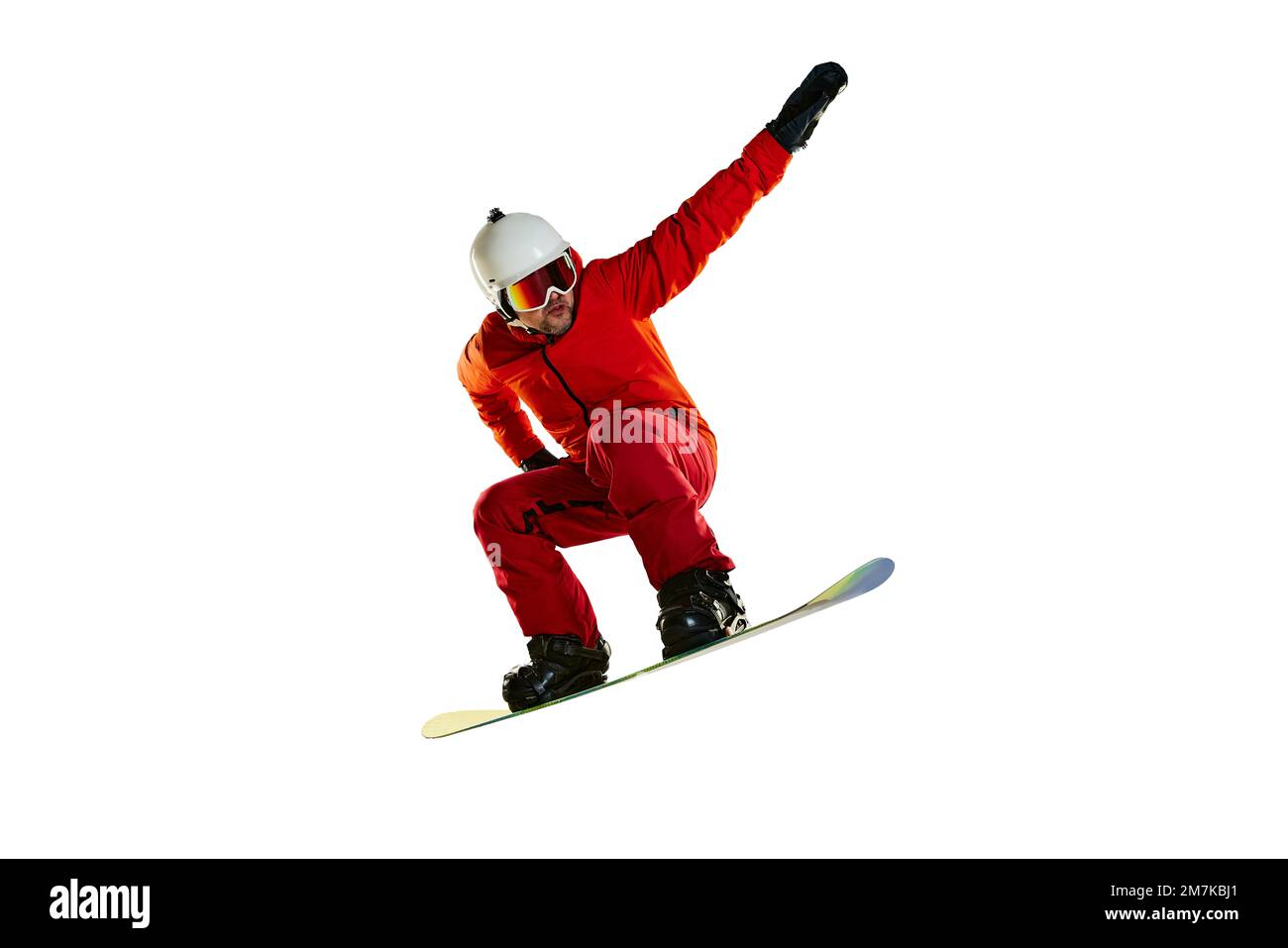 Portrait of active man, snowboarder in uniform riding on snowboard ...