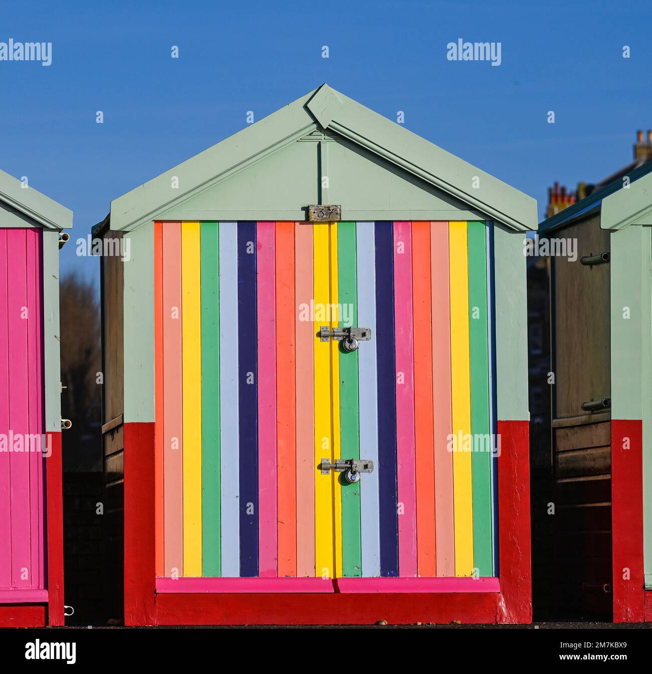 Colourful painted stripes on a beach hut along Hove seafront , Sussex ...