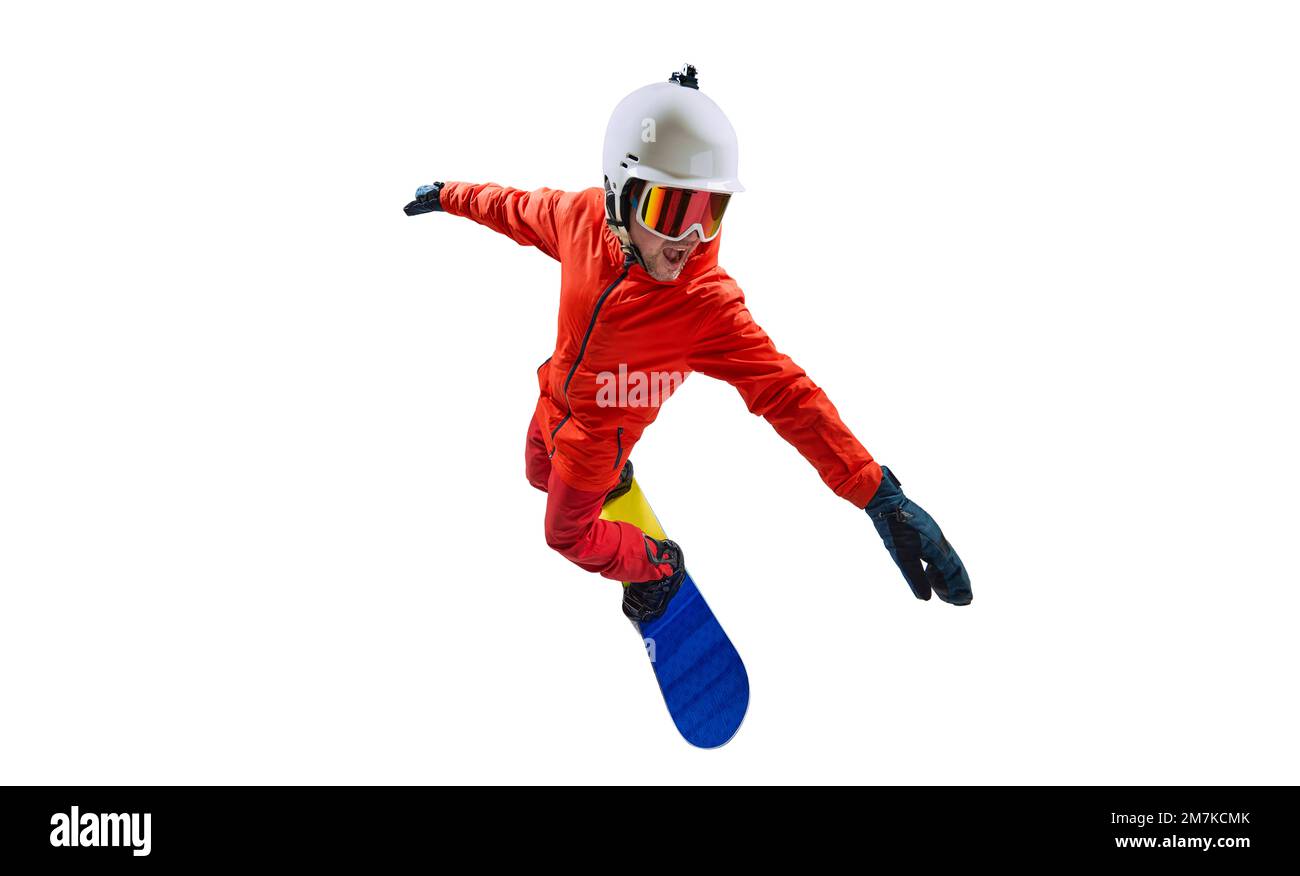 Portrait of active man, snowboarder in uniform riding on snowboard ...