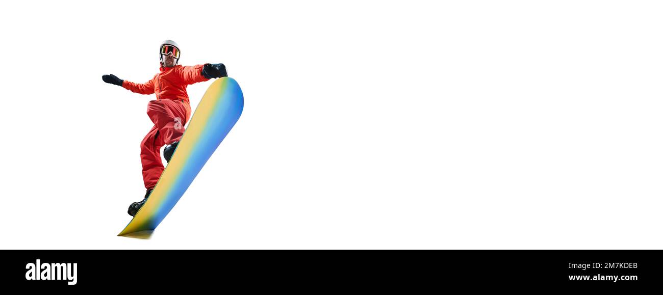 Portrait of active man, snowboarder in uniform riding on snowboard ...