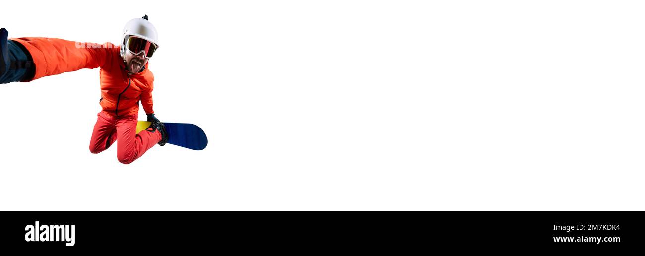 Taking photo in motion. Portrait of active man, snowboarder in uniform ...