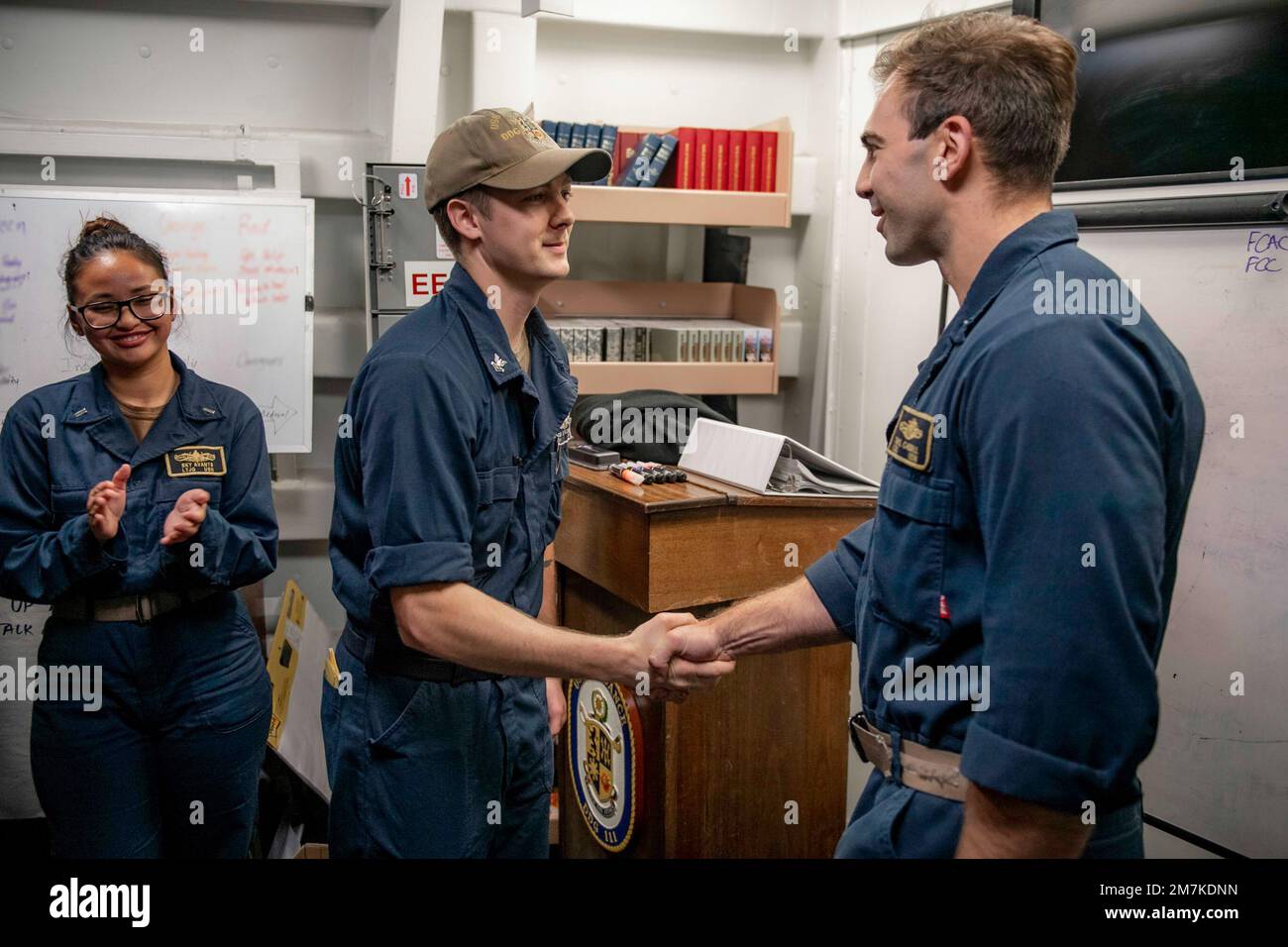 PHILIPPINE SEA (May 10, 2022) Lt. j.g. Tim Caudill, right ...