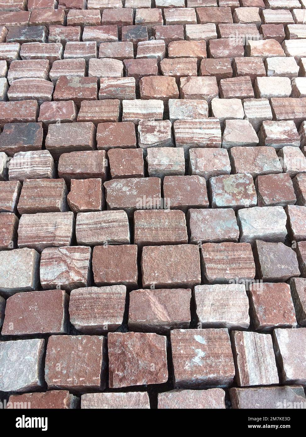 A vertical shot of beautiful paving stones without joints Stock Photo ...
