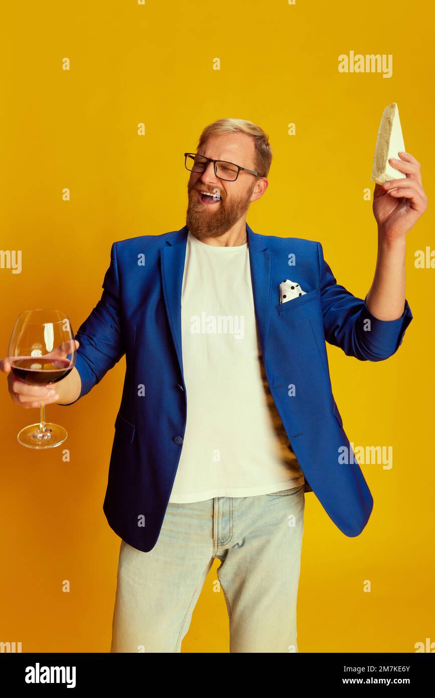 Emotional stylish middle age man in bright blue jacket and trousers ...