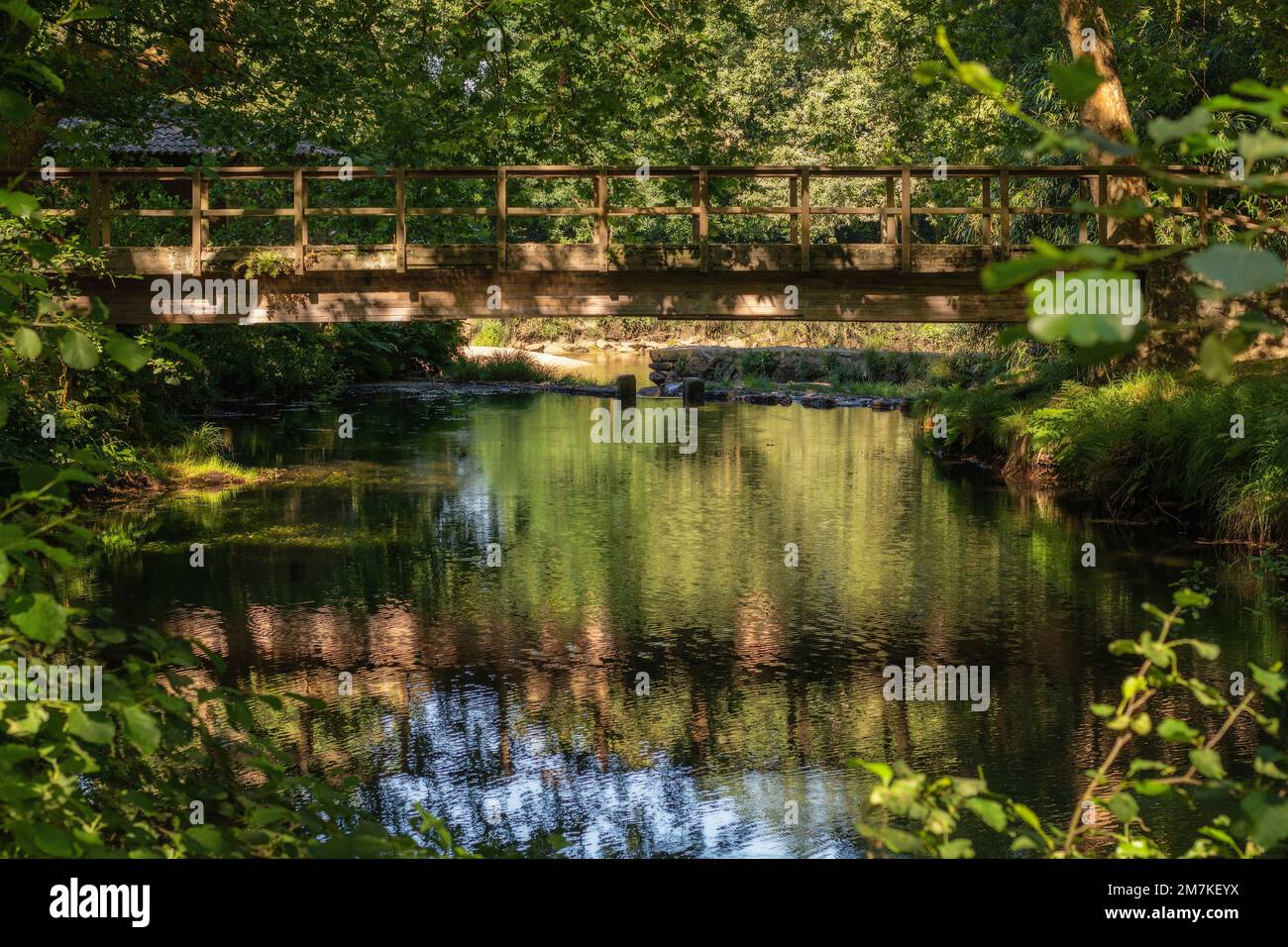 Wood bridge crosses the Tamuxe or Carballas river, near to an ancient ...