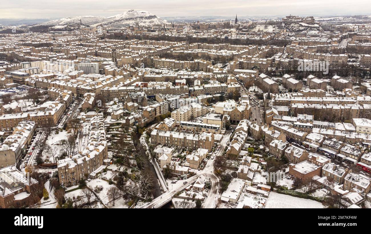 Aerial views of a snowfell Edinburgh from Inverleith park. The city is ...