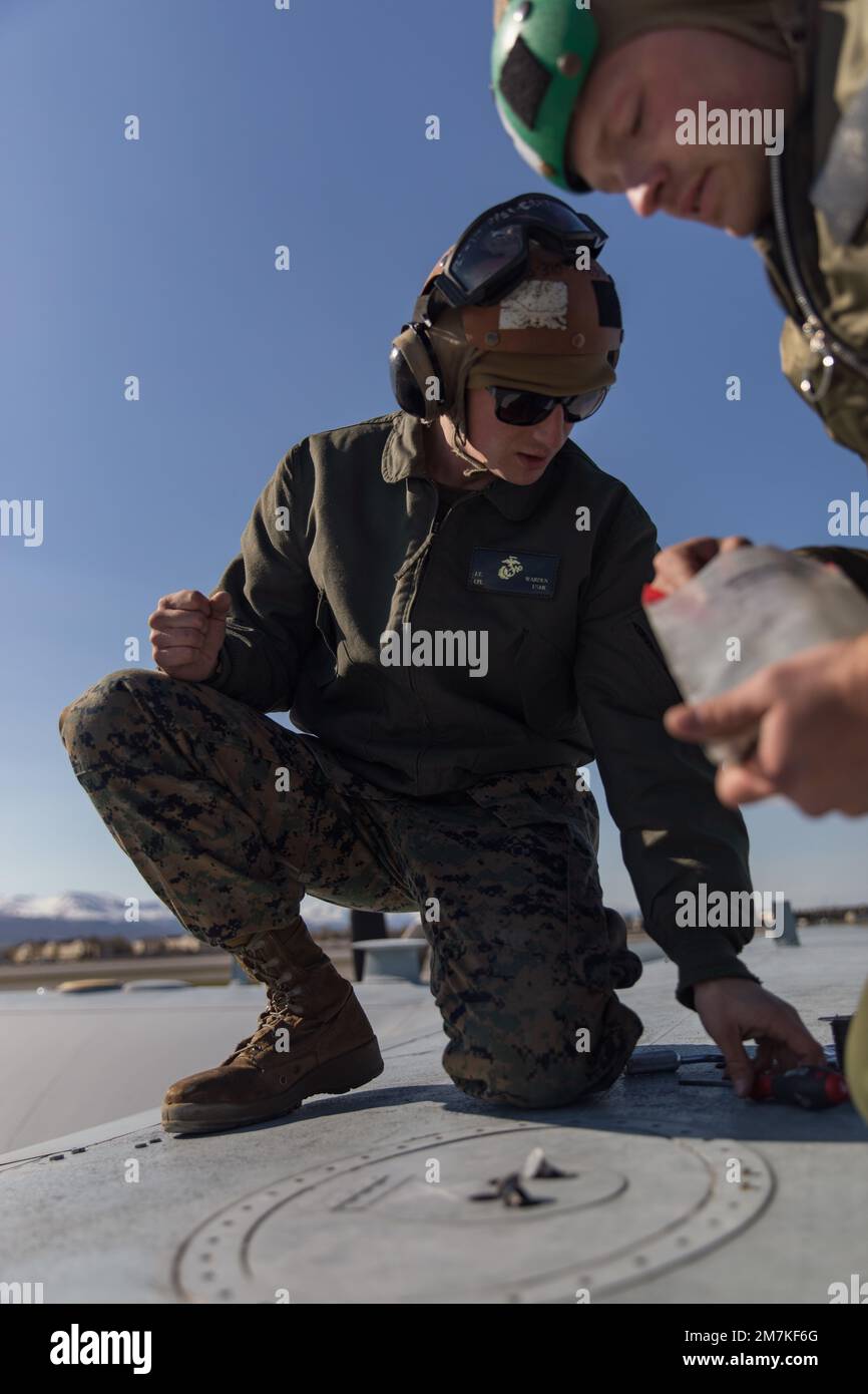 U.S. Marine Corps Cpl. Jason Warden, center, and Cpl. Simon Church ...