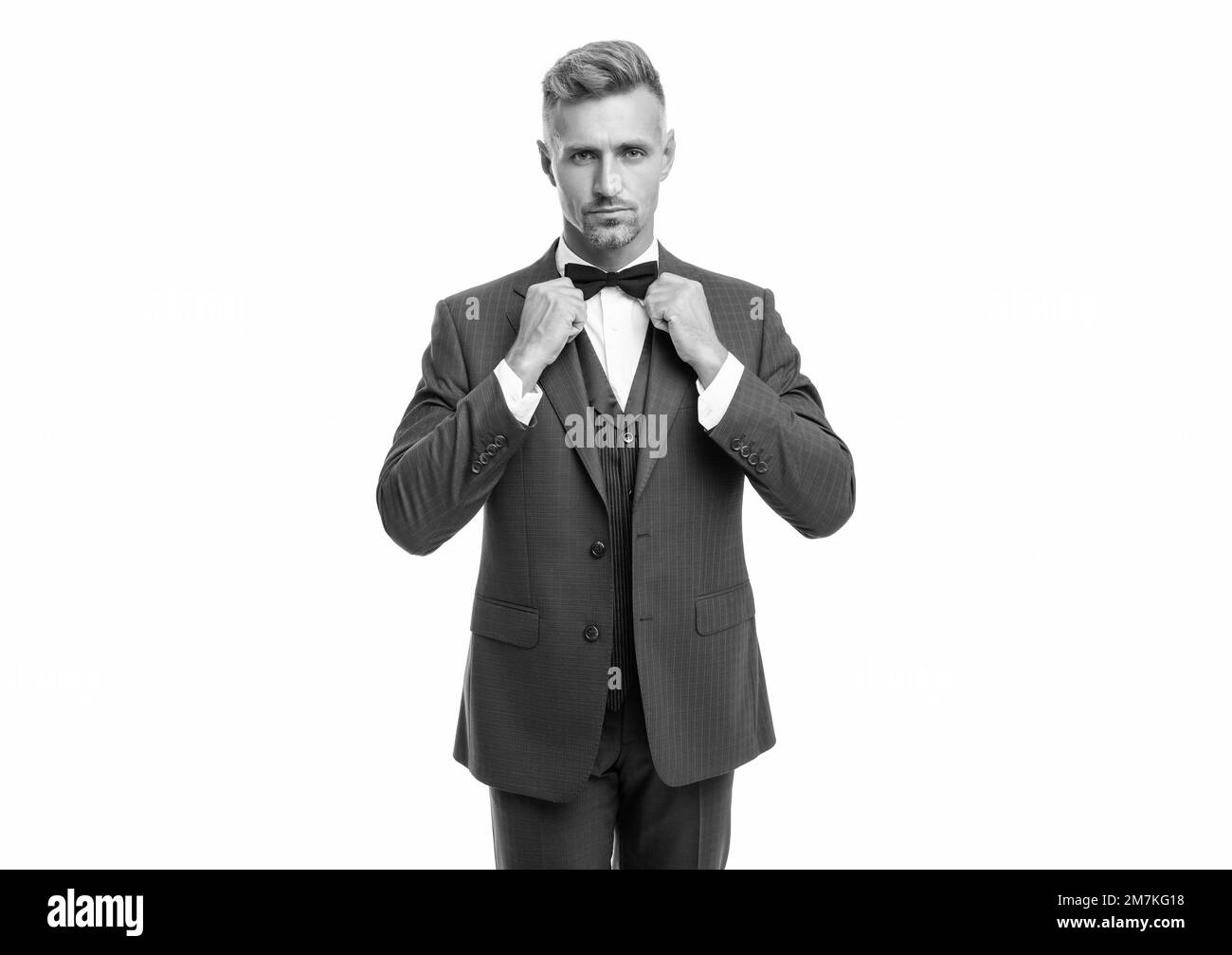 grizzled man in blue suit and bow tie. businessman isolated on white ...