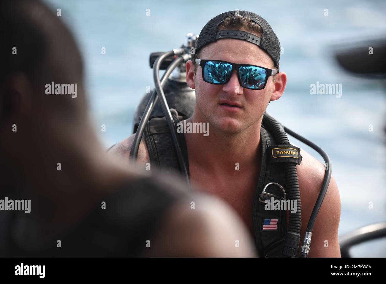 U.S. Navy Second Class Diver Jake Buyeske waits his turn to dive during ...