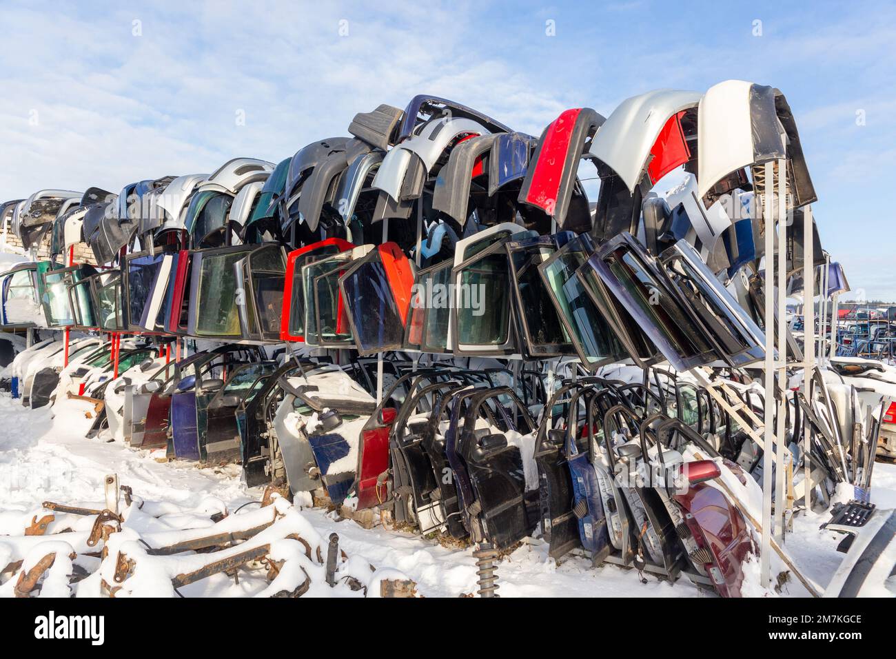 Disassembled cars on a car dump are on sale for spare parts. A stack of ...