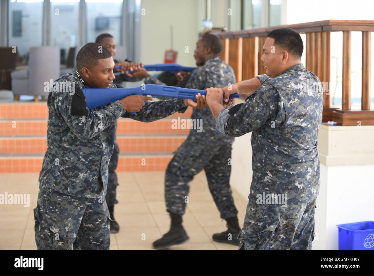 Members from the Belize Coast Guard practice weapons retention and gun ...
