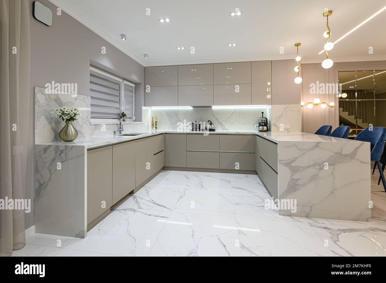 Luxury white modern marble kitchen in studio space Stock Photo - Alamy
