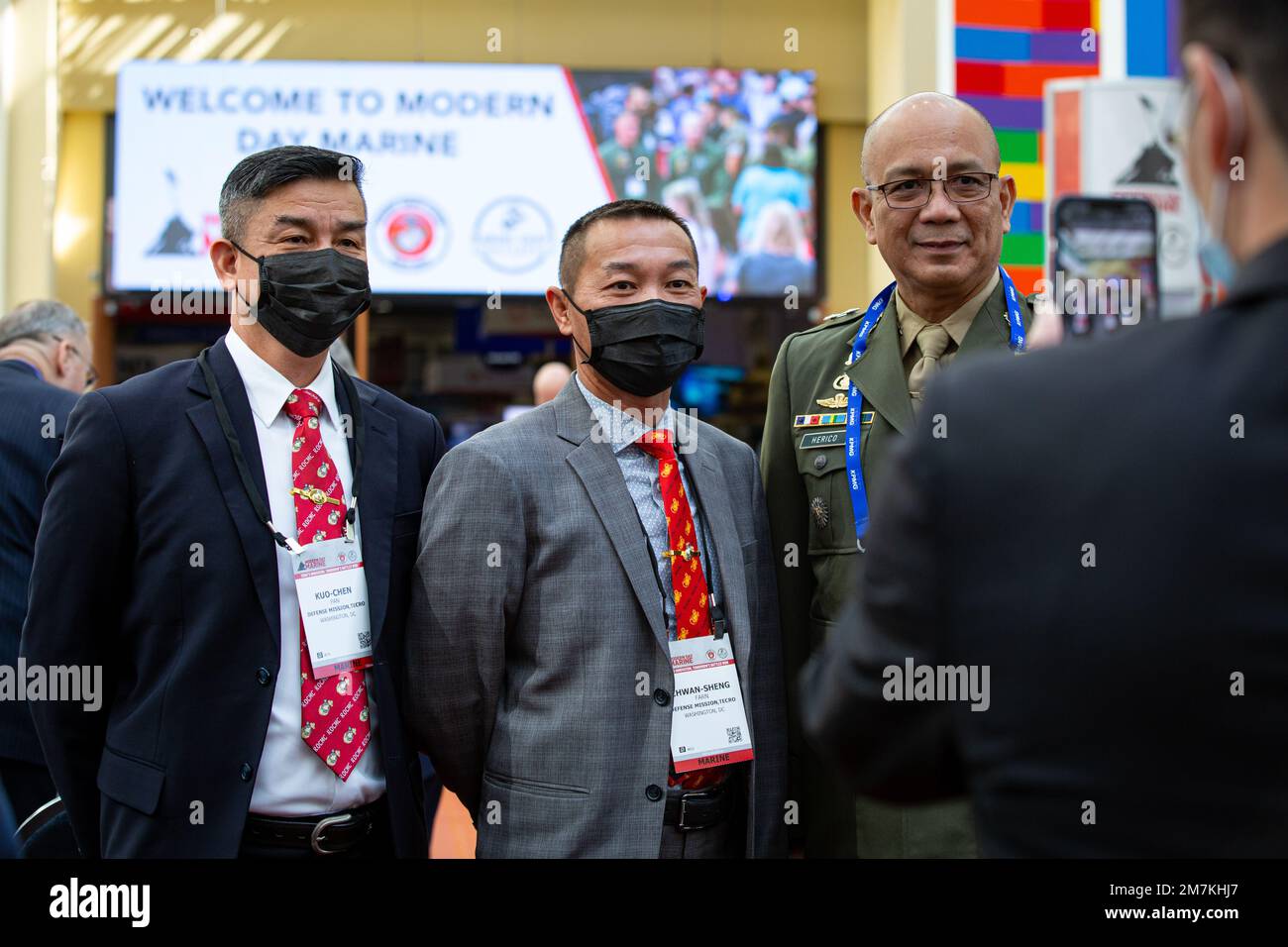Attendees of the ribbon cutting ceremony pose for a photo during Modern ...