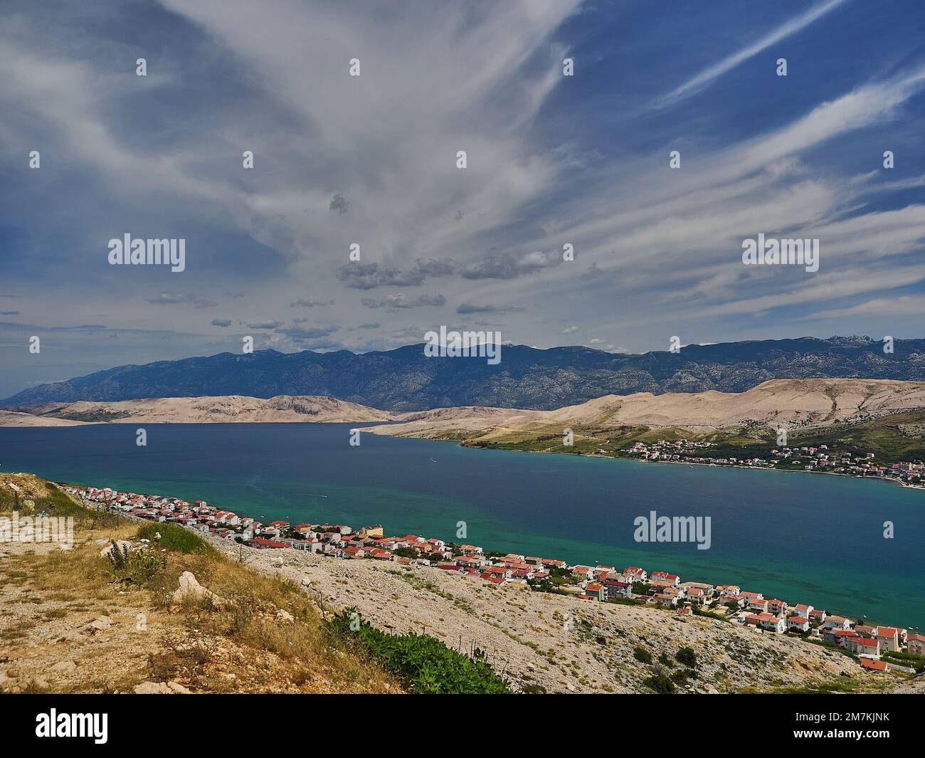 dry and arid coastline of Pag island in Croatia with turquoise water on ...
