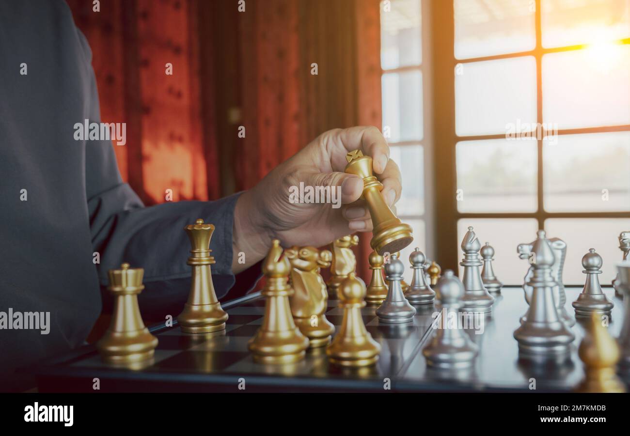Concentrated businessman developing chess gambit, strategy ,playing ...