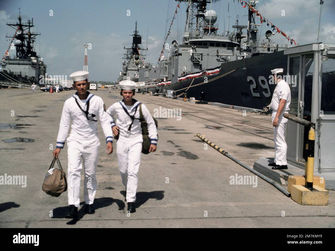 Venezuelan sailors walk along the pier after their vessel docked in ...