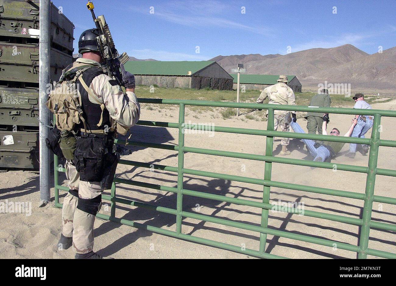 Rescue force member, holding an M-4 carbine with an M203 40mm grenade ...