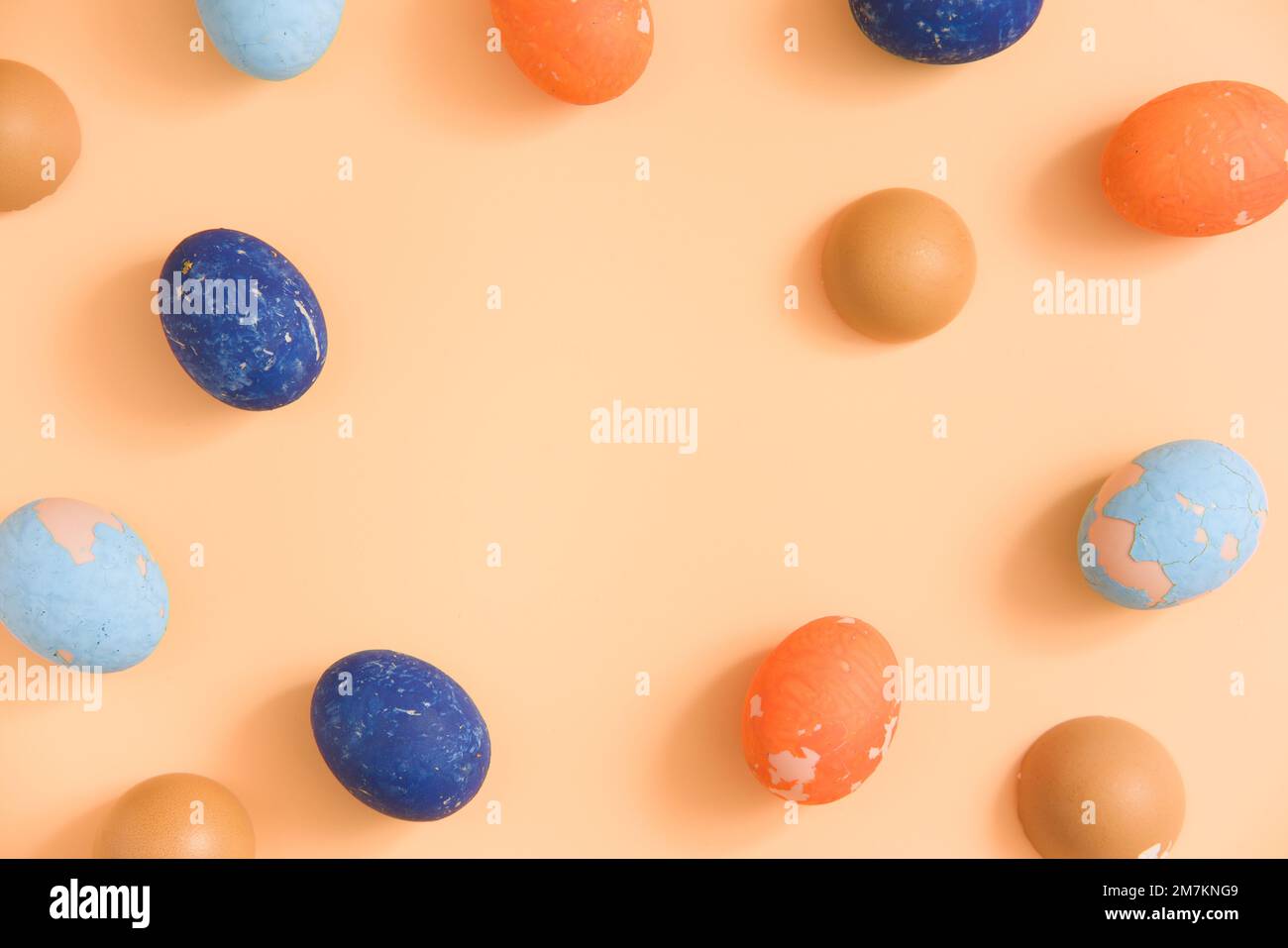 Copy space Easter colored eggs on a beige background. Frame. mock-up ...