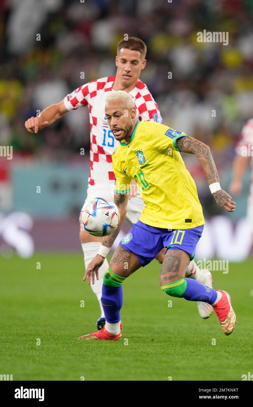 Brazil's Neymar, front, fights for the ball against Croatia's Mario ...