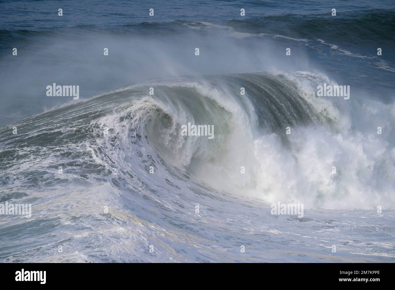 A wave crashes at Praia do Norte, or North Beach, in Nazare, Portugal ...