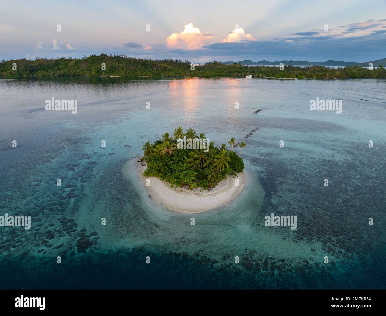 A beautiful coral reef surrounds a scenic island in the Solomon Islands ...