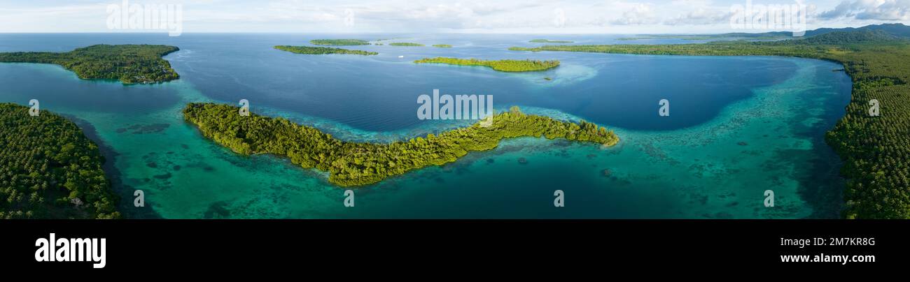 Extensive coral reefs fringe rainforest-covered islands in the Solomon ...