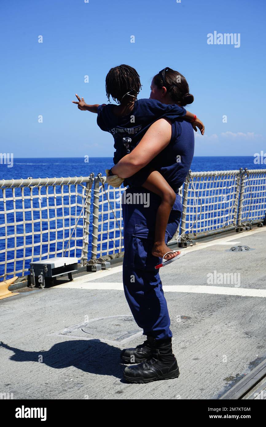A Coast Guard Cutter Campbell crew member hangs out on the flight deck ...