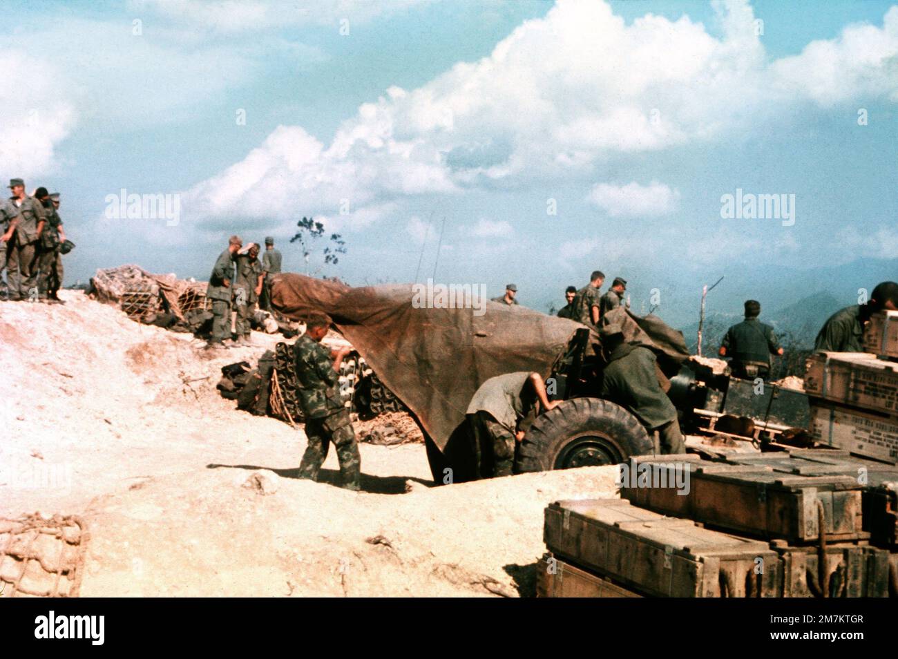Members of the 3rd Marine Division set up a howitzer during ...