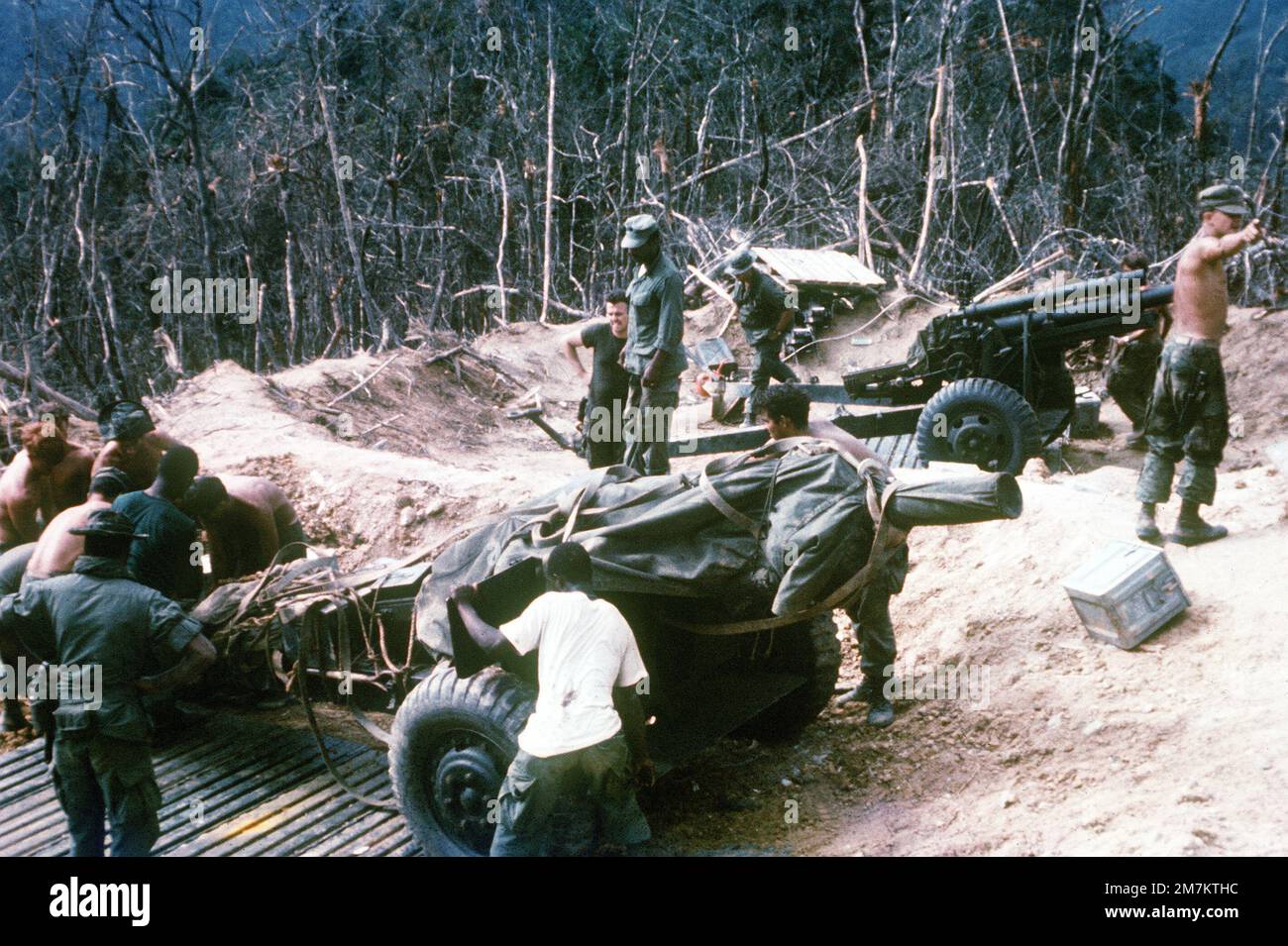 Members of the 3rd Marine Division set up two M-101 105mm howitzers ...