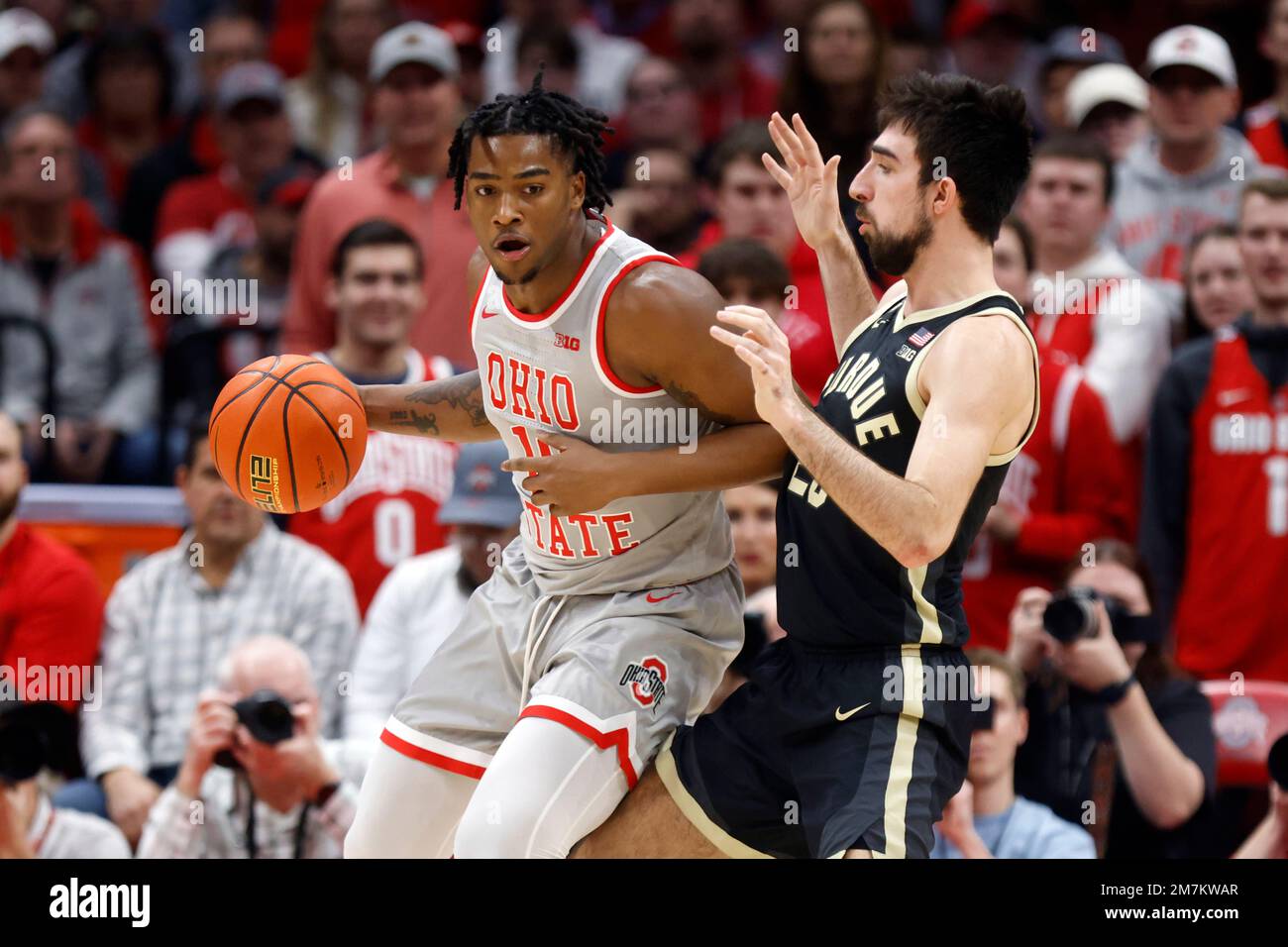 Ohio State forward Brice Sensabaugh, left, drives in front of Purdue ...