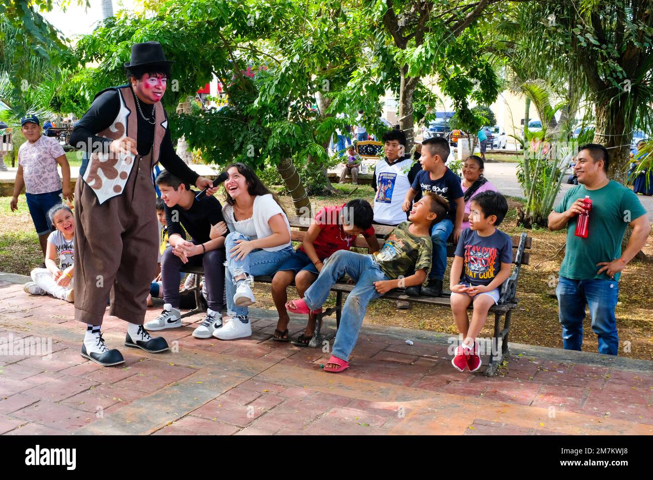 Clown entertaining children at the main plaza in Tizimin, Yucatan ...