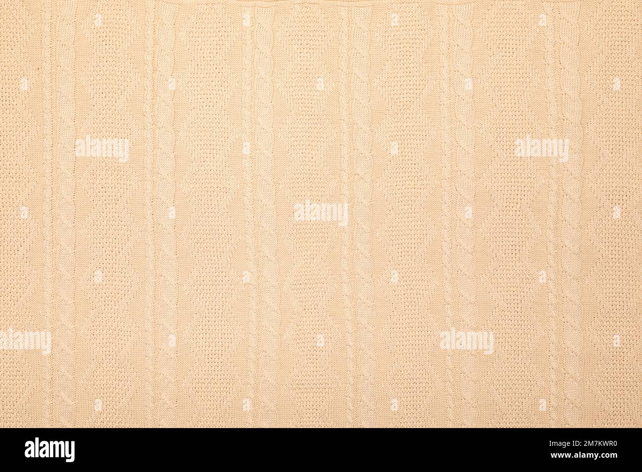 Real beige knitted fabric with cable pattern textured background Stock ...