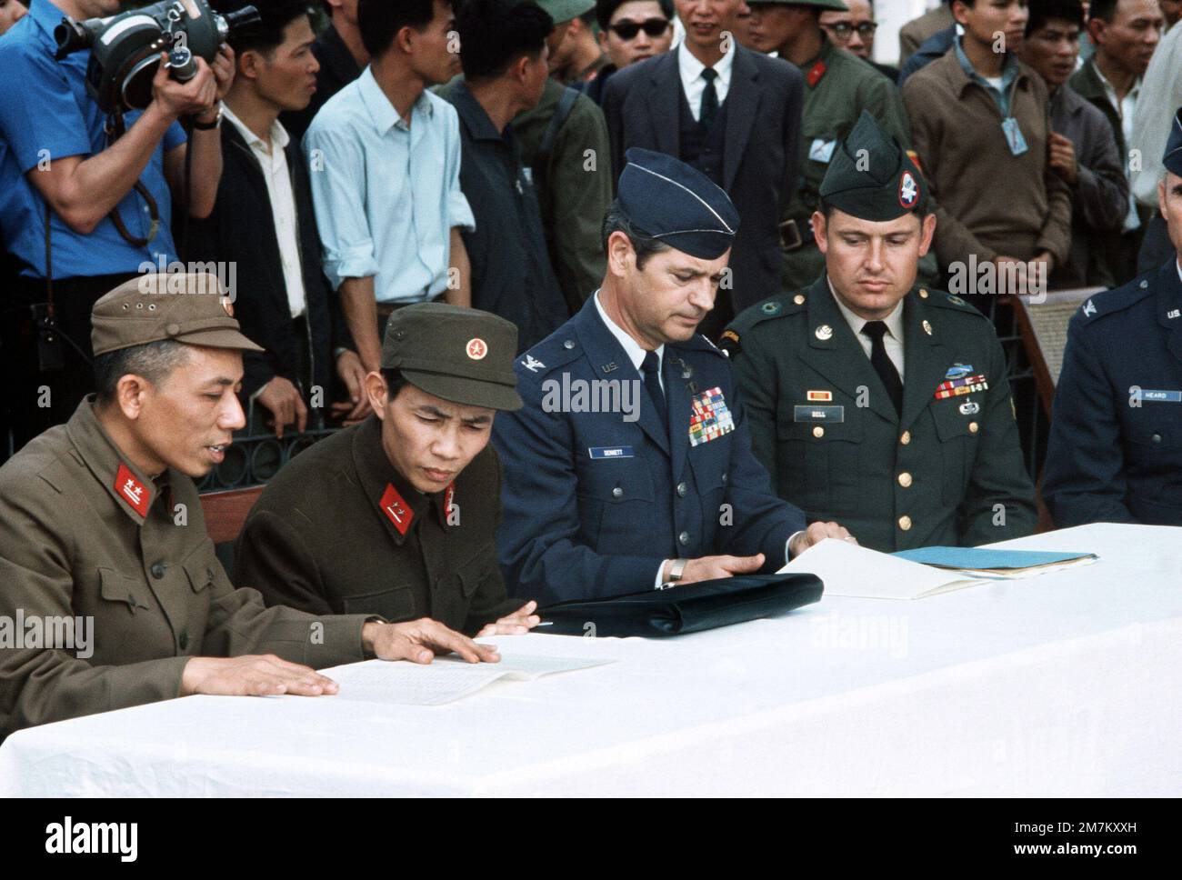From right to left: COL Heard, SPC 6 Bell and COL J.P. Dennett, part of ...
