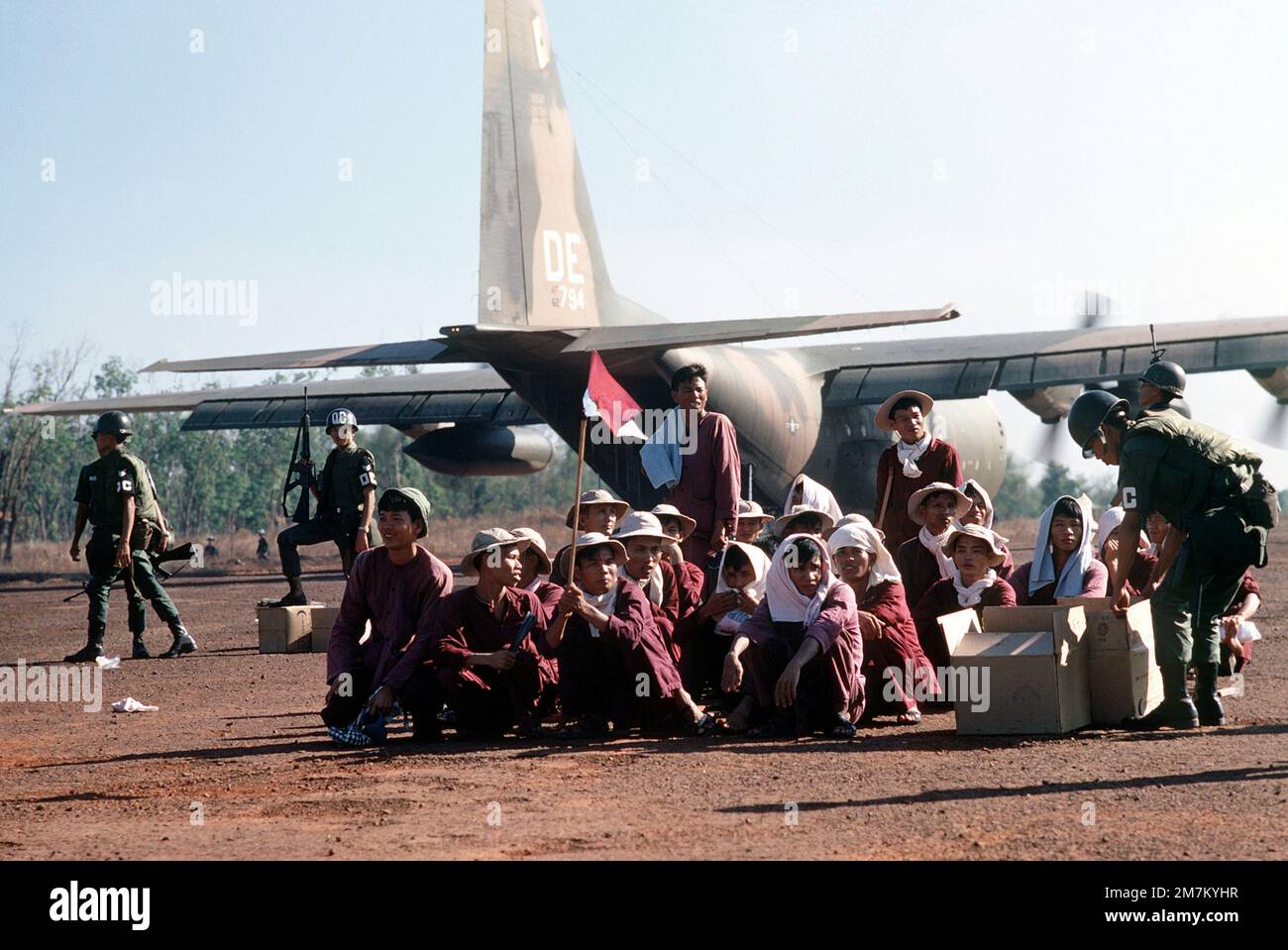 Viet Cong prisoners of war are gathered together in a group prior to ...
