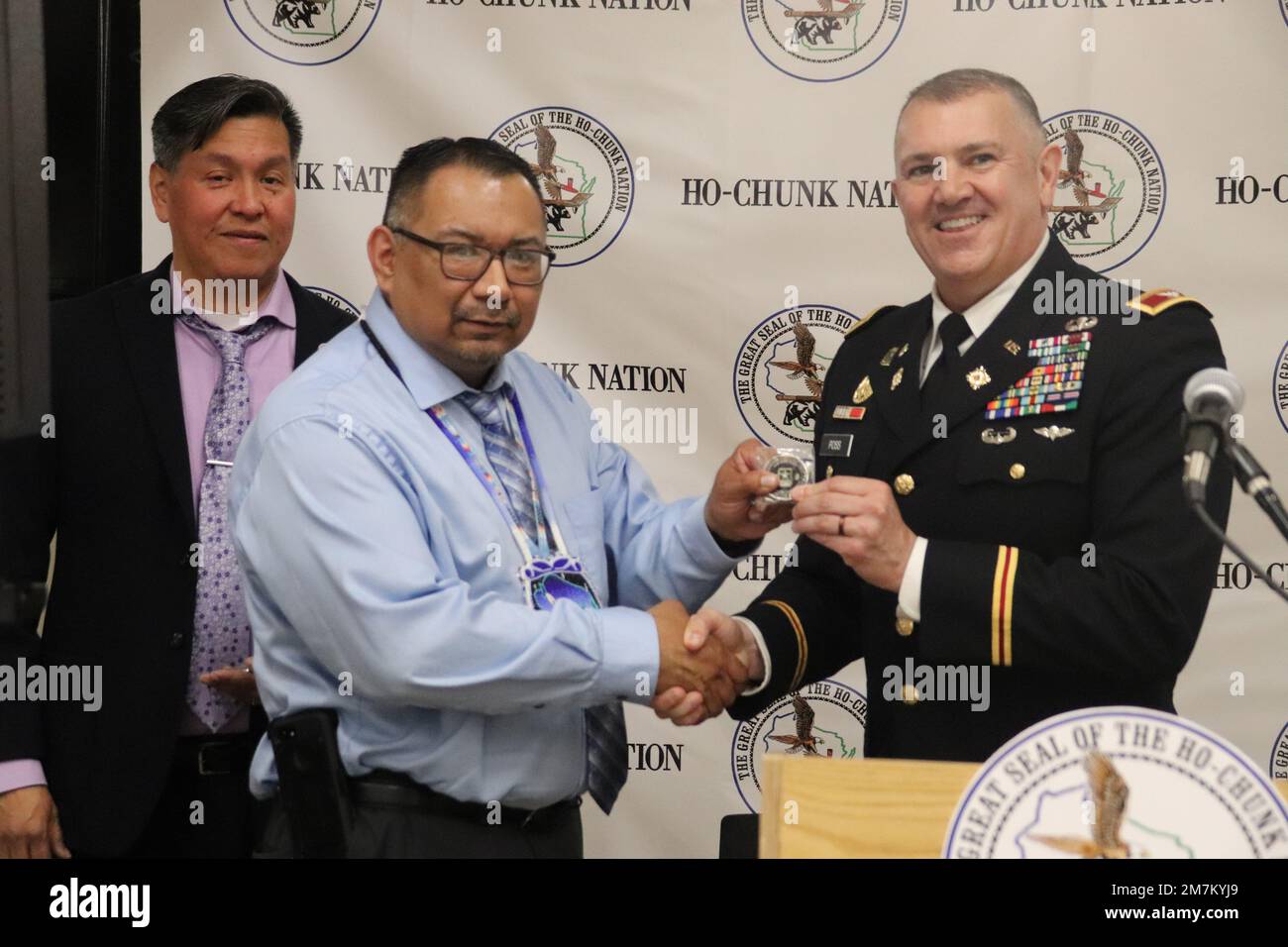 A Ho-Chunk Nation member receives a commander’s coin from Fort McCoy ...