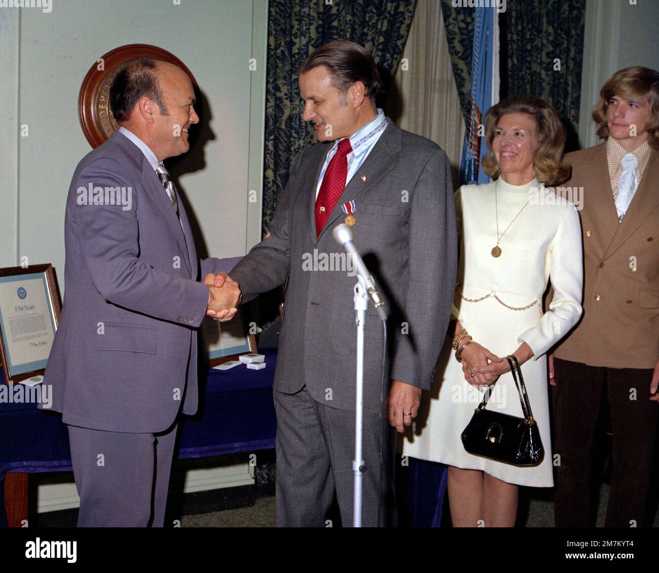 Secretary of Defense Melvin R. Laird, left, congratulates Assistant ...