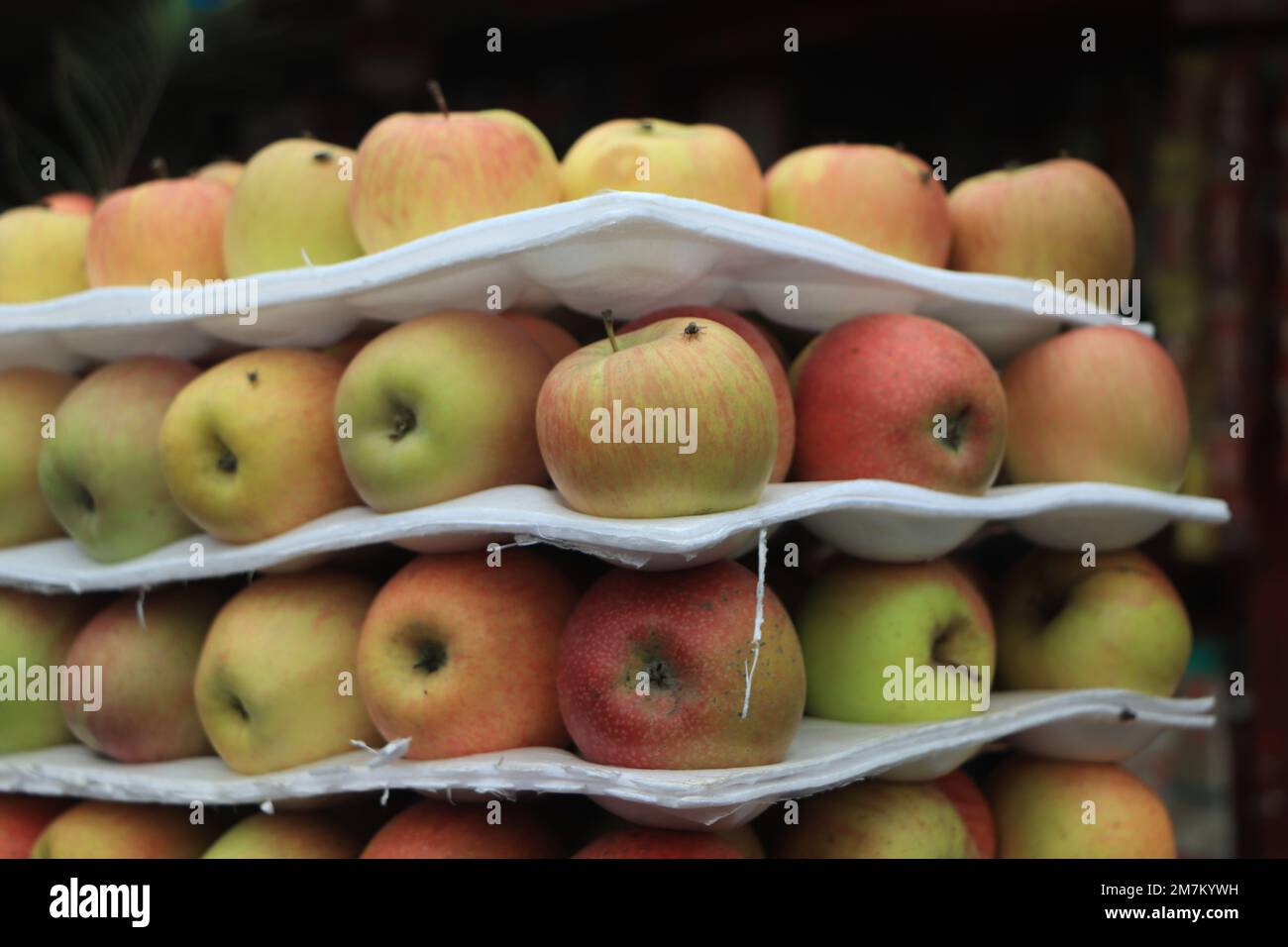 Red apples on white satin fabric, background Stock Photo - Alamy