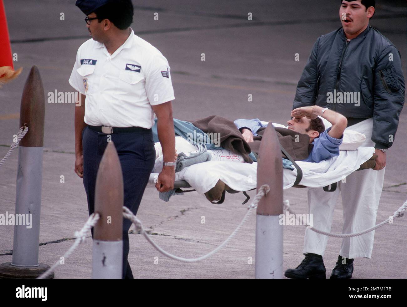 Former POW and U.S. Air Force TSGT James R. Cook salutes the colors ...