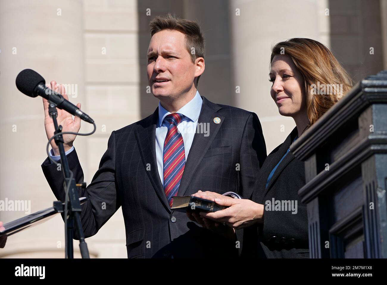 Oklahoma Lt. Gov. Matt Pinnell, left takes his oath of office with his ...