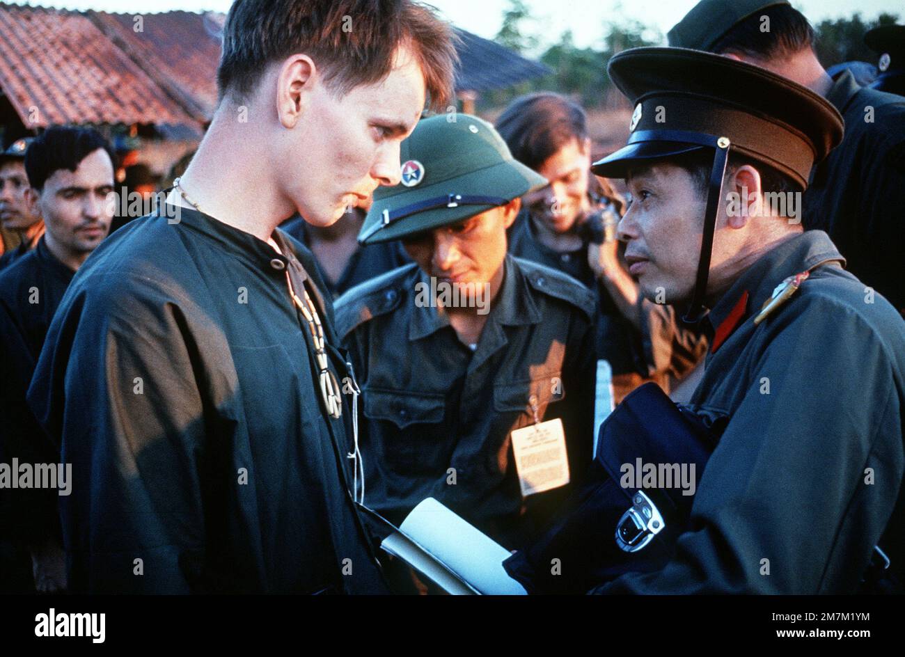 SPC-4 Richard Springman, U.S. Army, Captured 25 May 70) talks with a ...