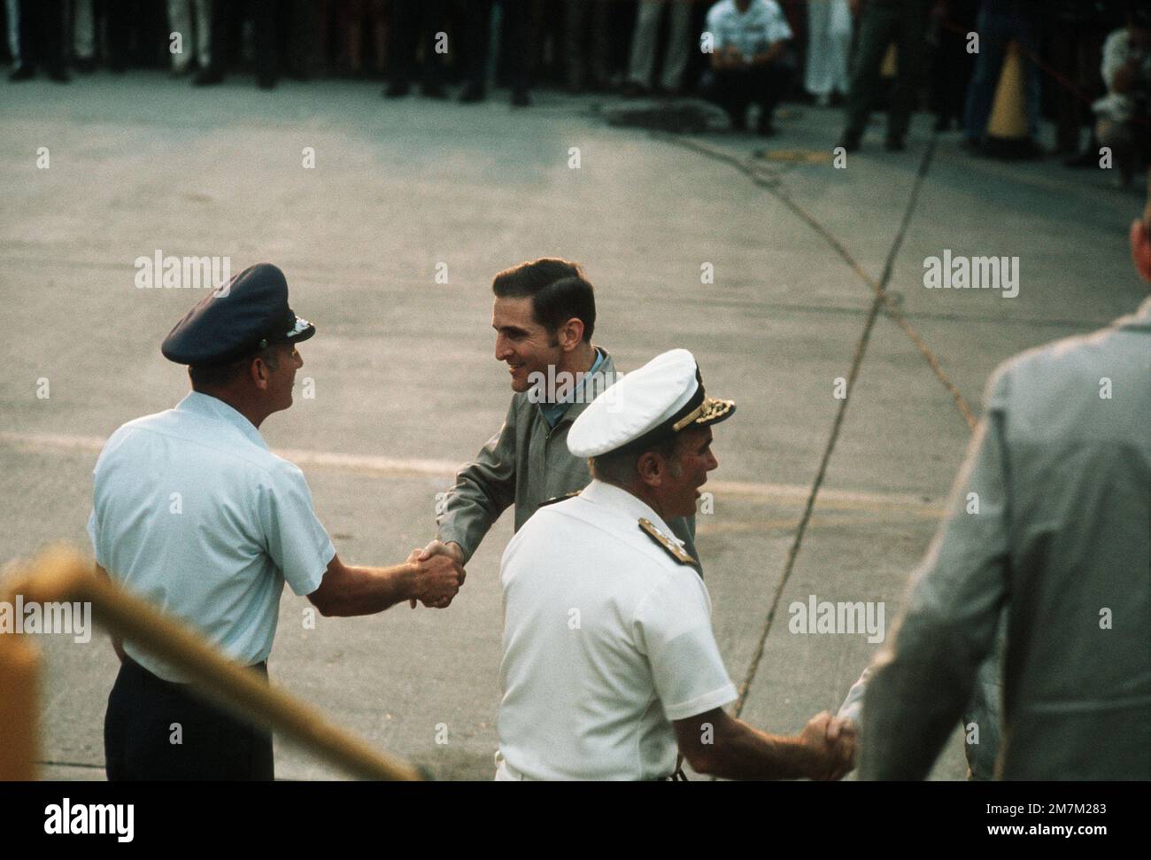 Ex-POW is greeted upon arriving by LGEN William G. Moore Jr., Commander ...
