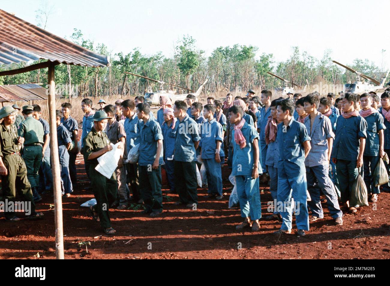 On a barren field near Loc Ninh South Vietnamese prisoners of war are ...