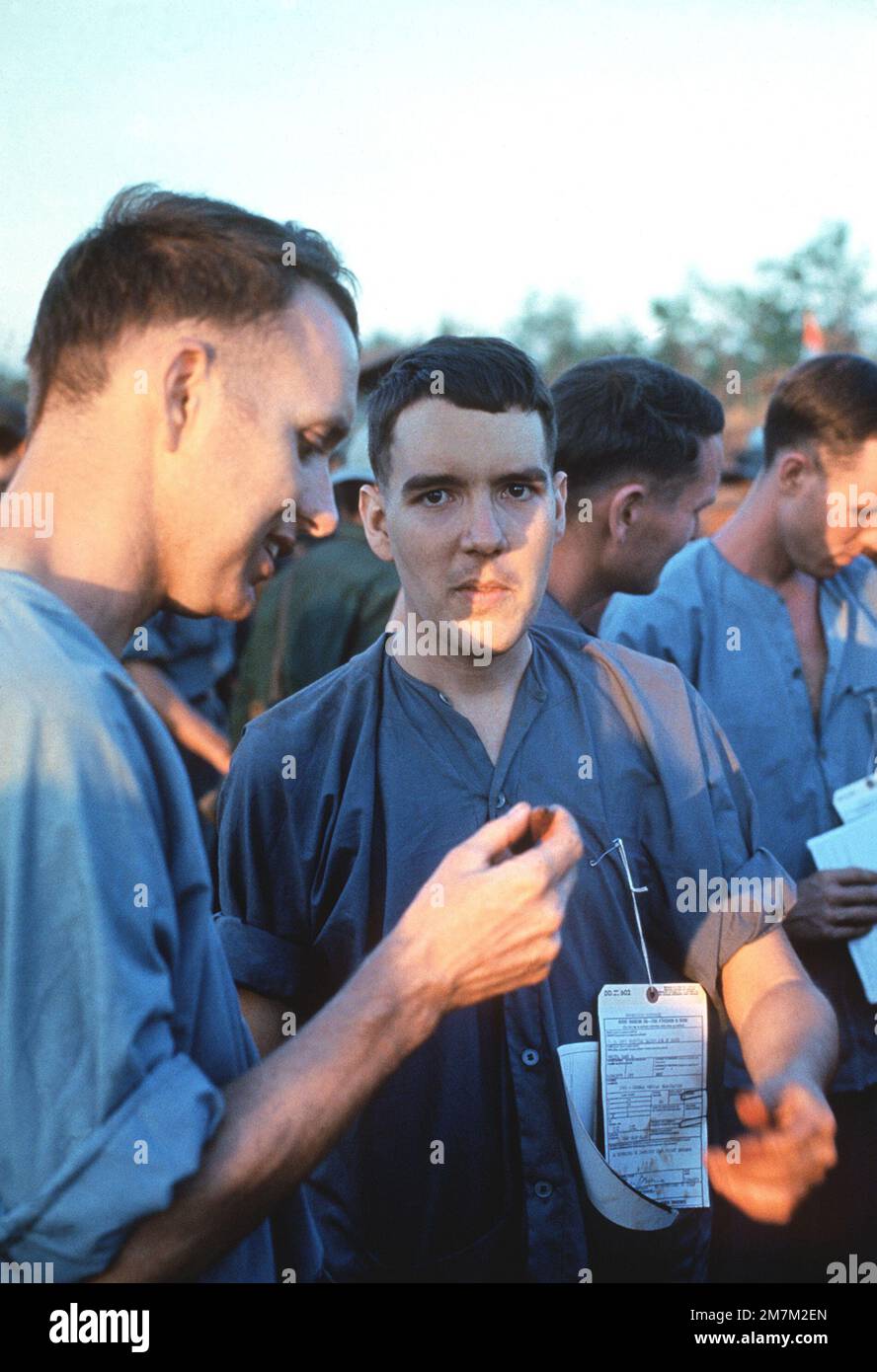 (On left) Mr. Michael Kjome, U.S. civilian and fellow POW, CPT Mark A ...