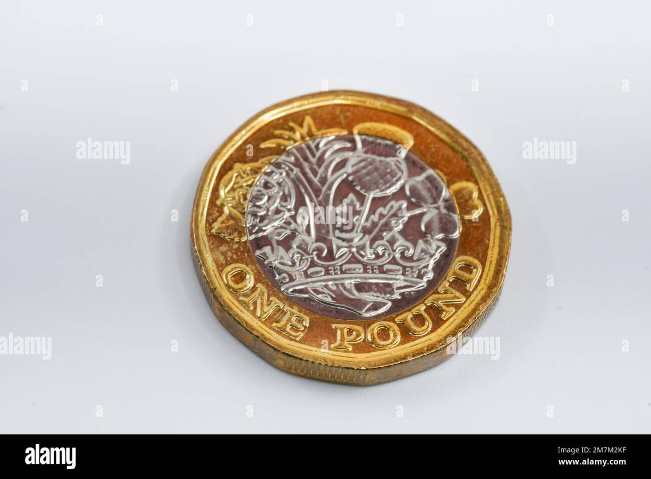 Close up view of a British One Pound coin isolated on a plain white ...