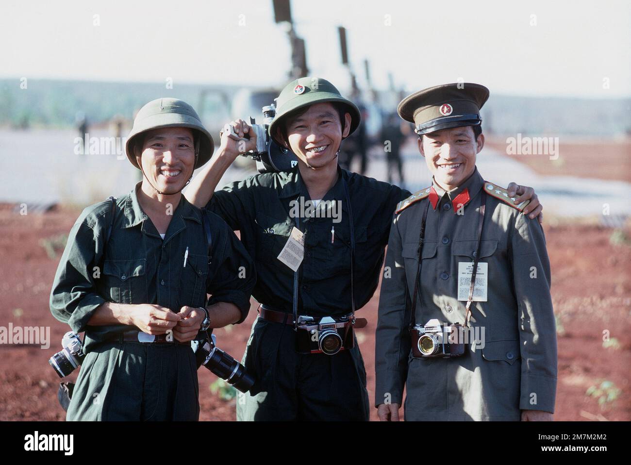 Two Viet Cong and a North Vietnamese Army officer with still and motion ...