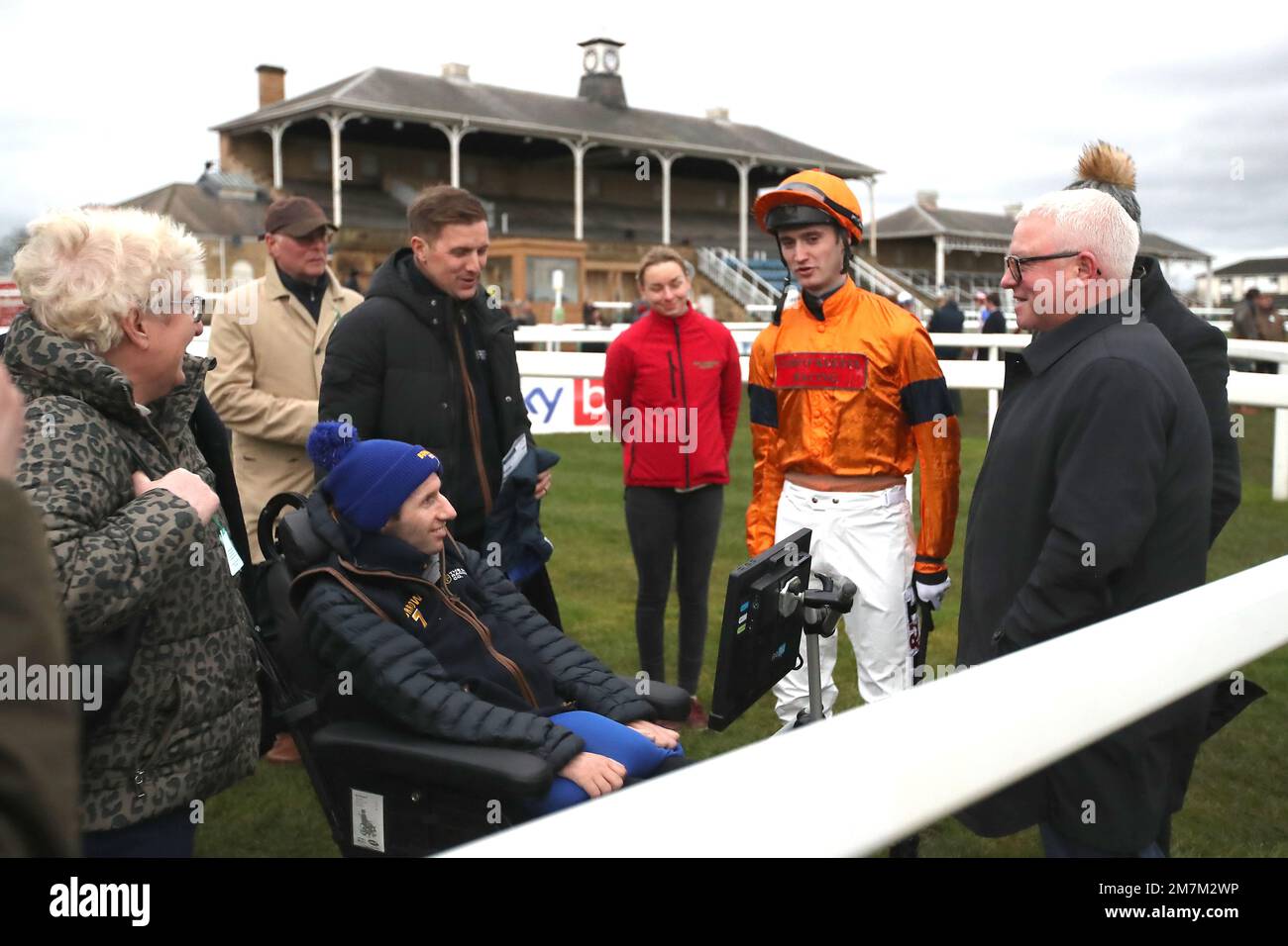Jockey Jack Garritty (second right) speaks with former rugby league ...